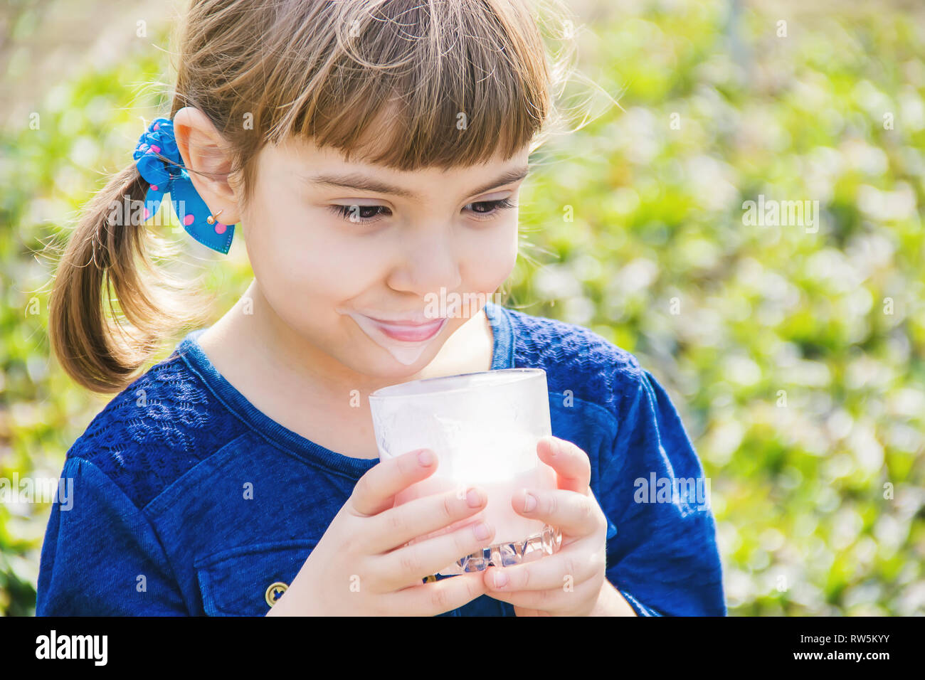 The child drinks milk. Selective focus. Kids Stock Photo - Alamy