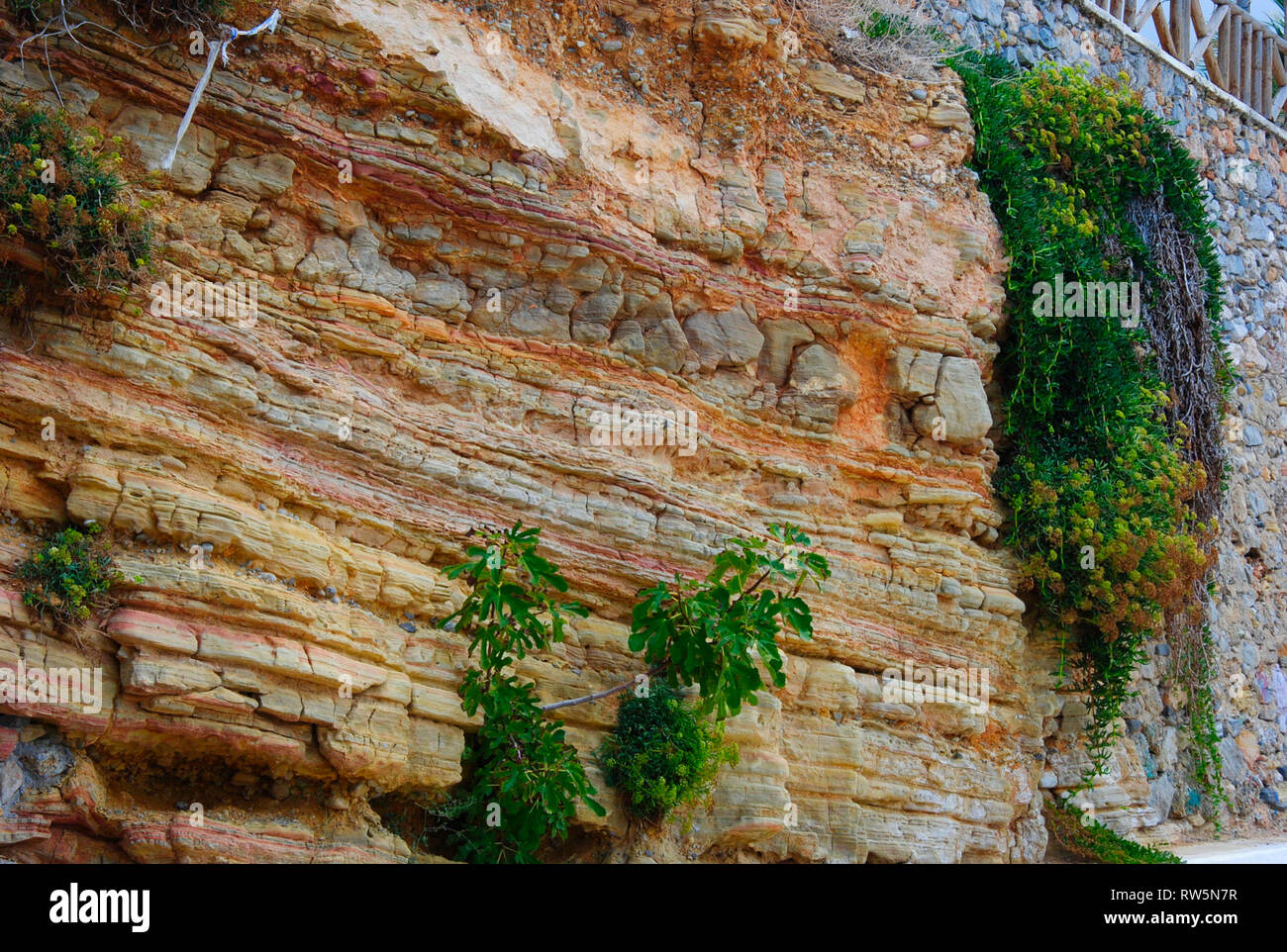 different layers of soil and a wall of bricks in Sisi, Crete, Greece ...