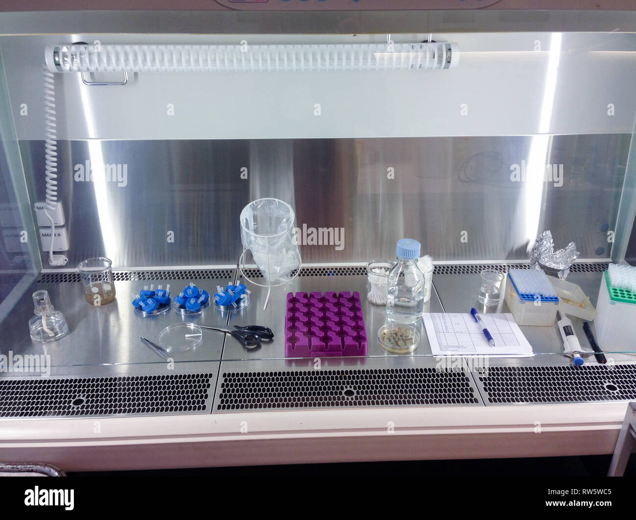 Flow hood in a lab in use with lab materials Stock Photo - Alamy