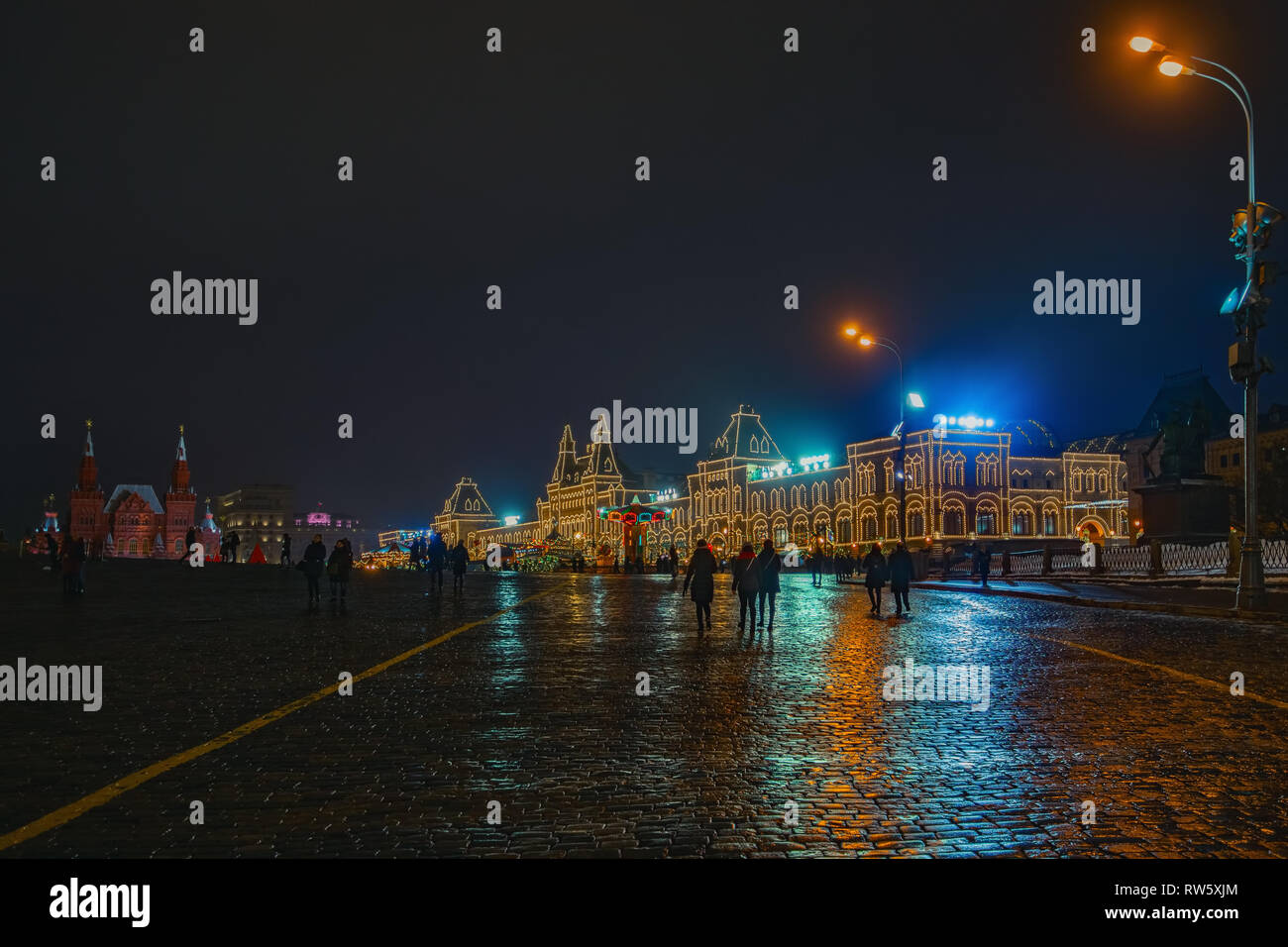 Kremlin, Red Square department store at night. Shining asphalt after ...
