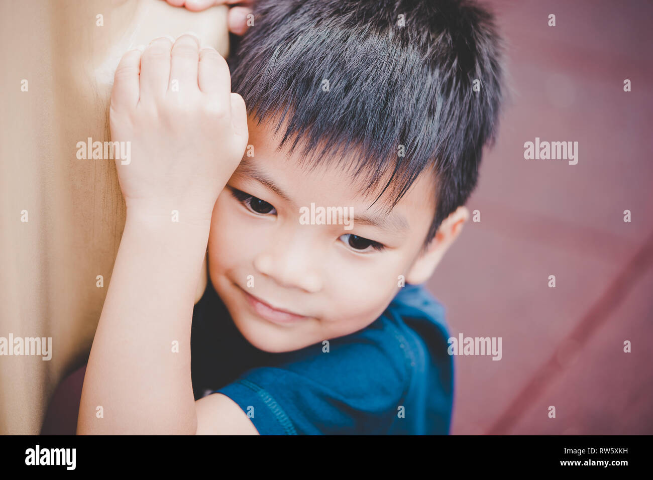 Sad Asian boy portrait on playing in playground Stock Photo - Alamy
