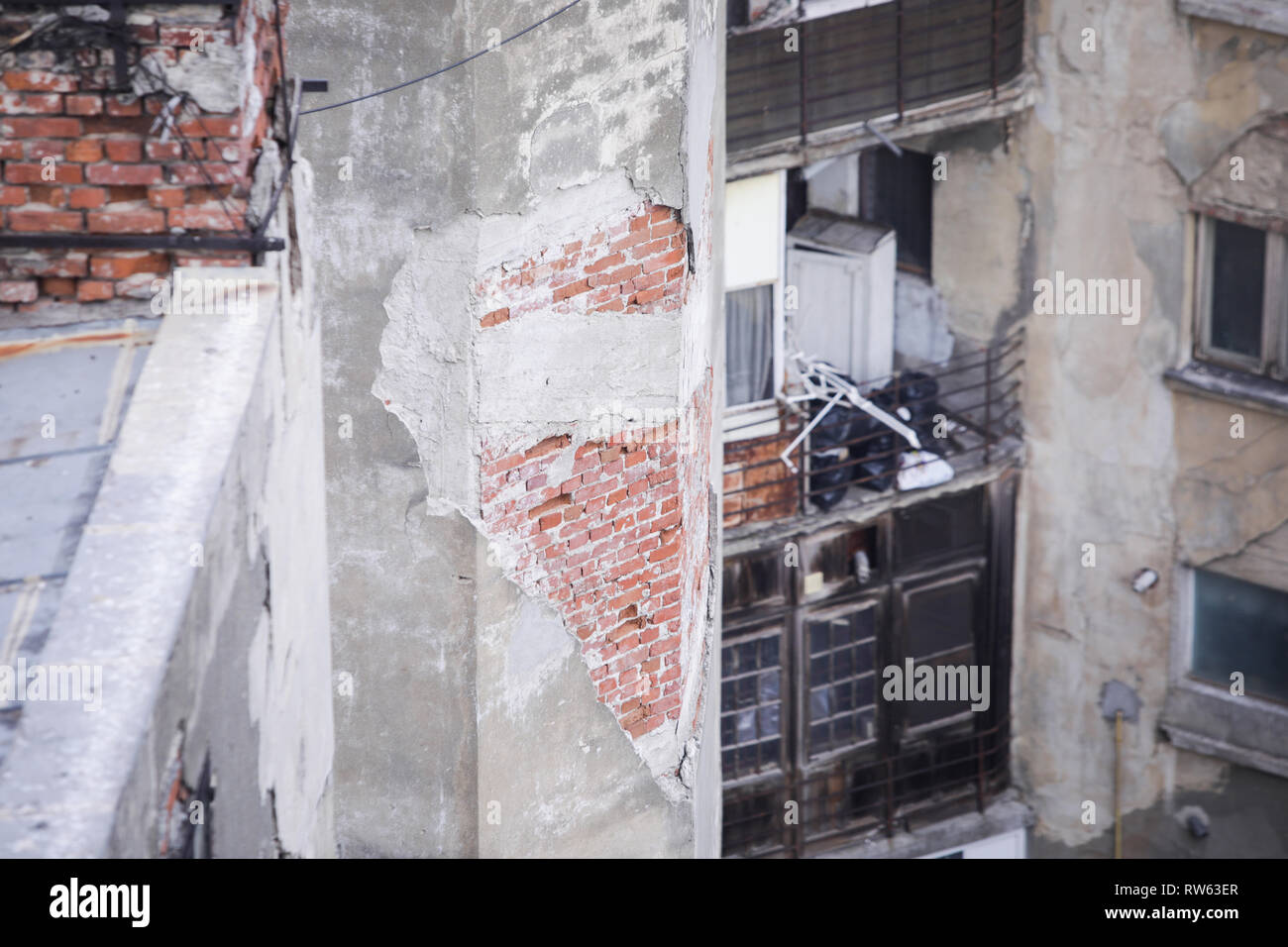 Inhabited, old and decayed (almost ruined) building in the old part of ...