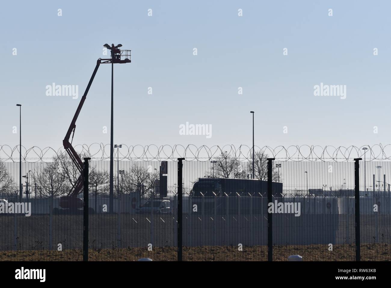 Street light maintenance — an electrical engineer carries out his work ...