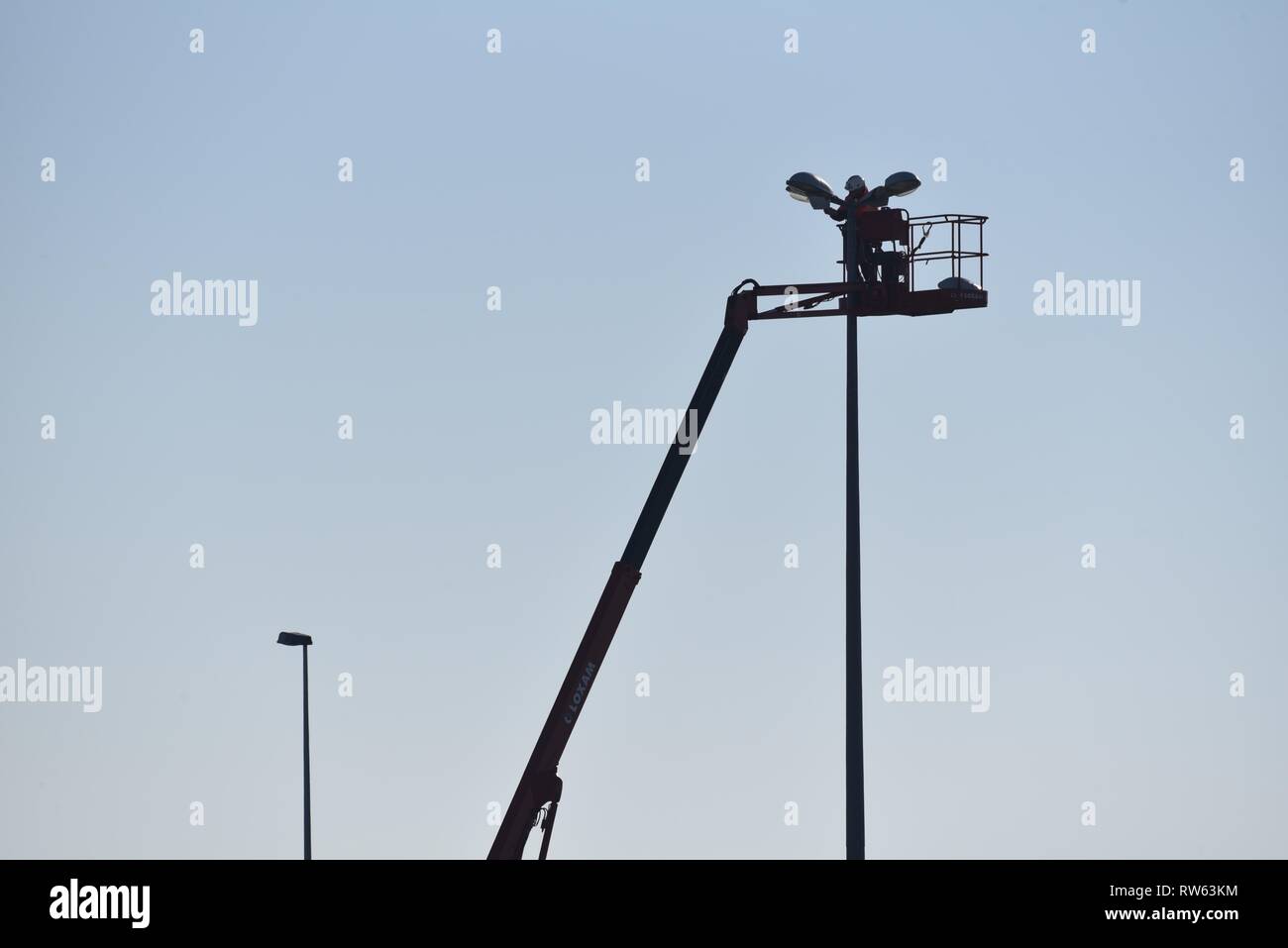 Street light maintenance — an electrical engineer carries out his work ...