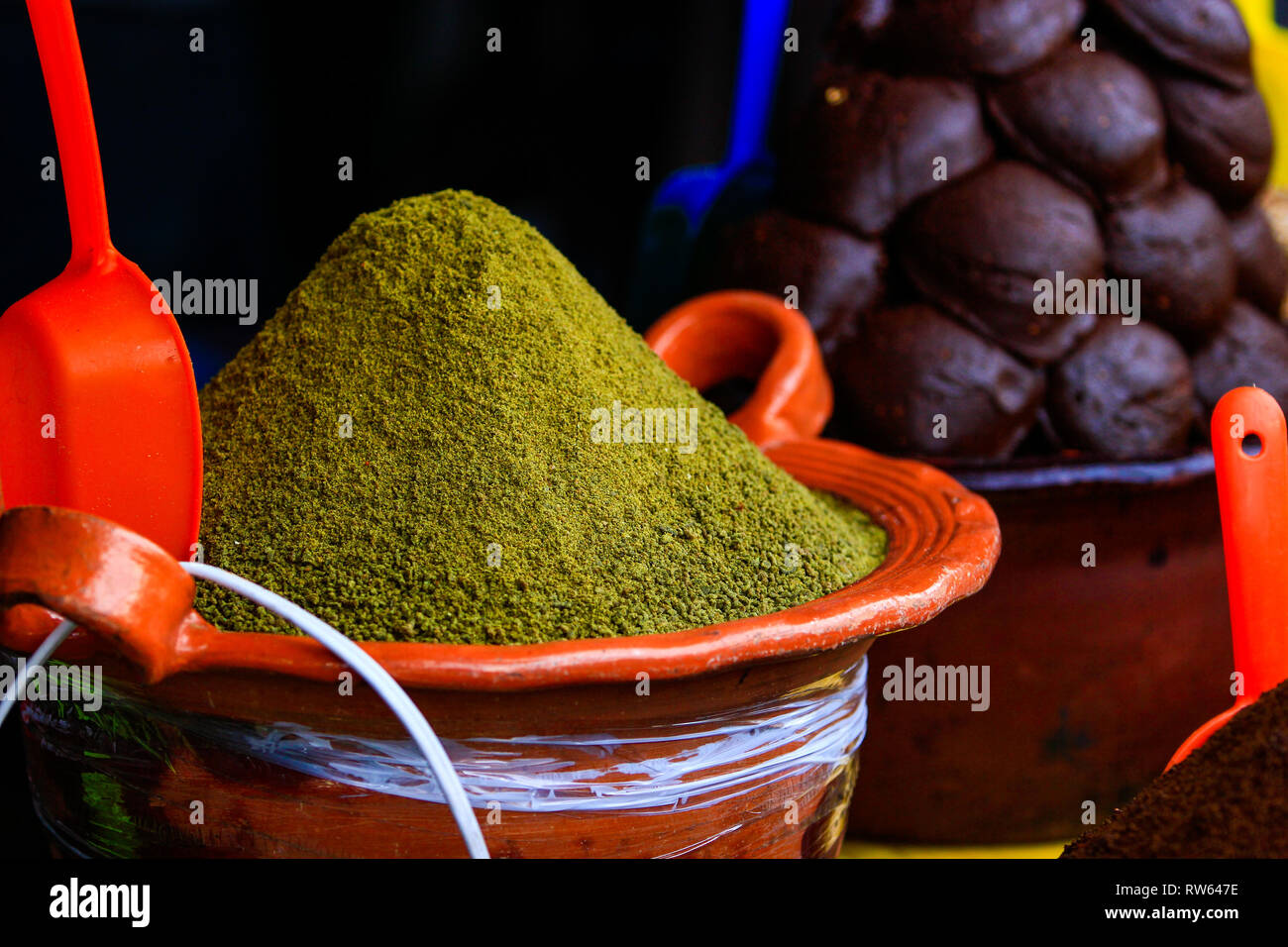 Big handmade mexican clay pot with podwer to prepare green mexican mole ...