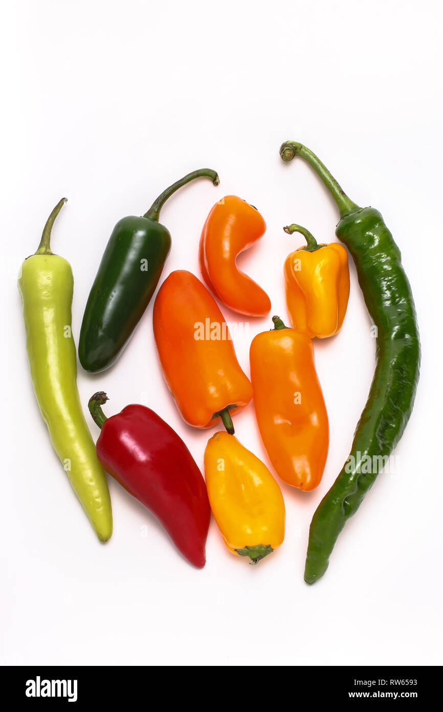 Mixed peppers on white background Stock Photo - Alamy