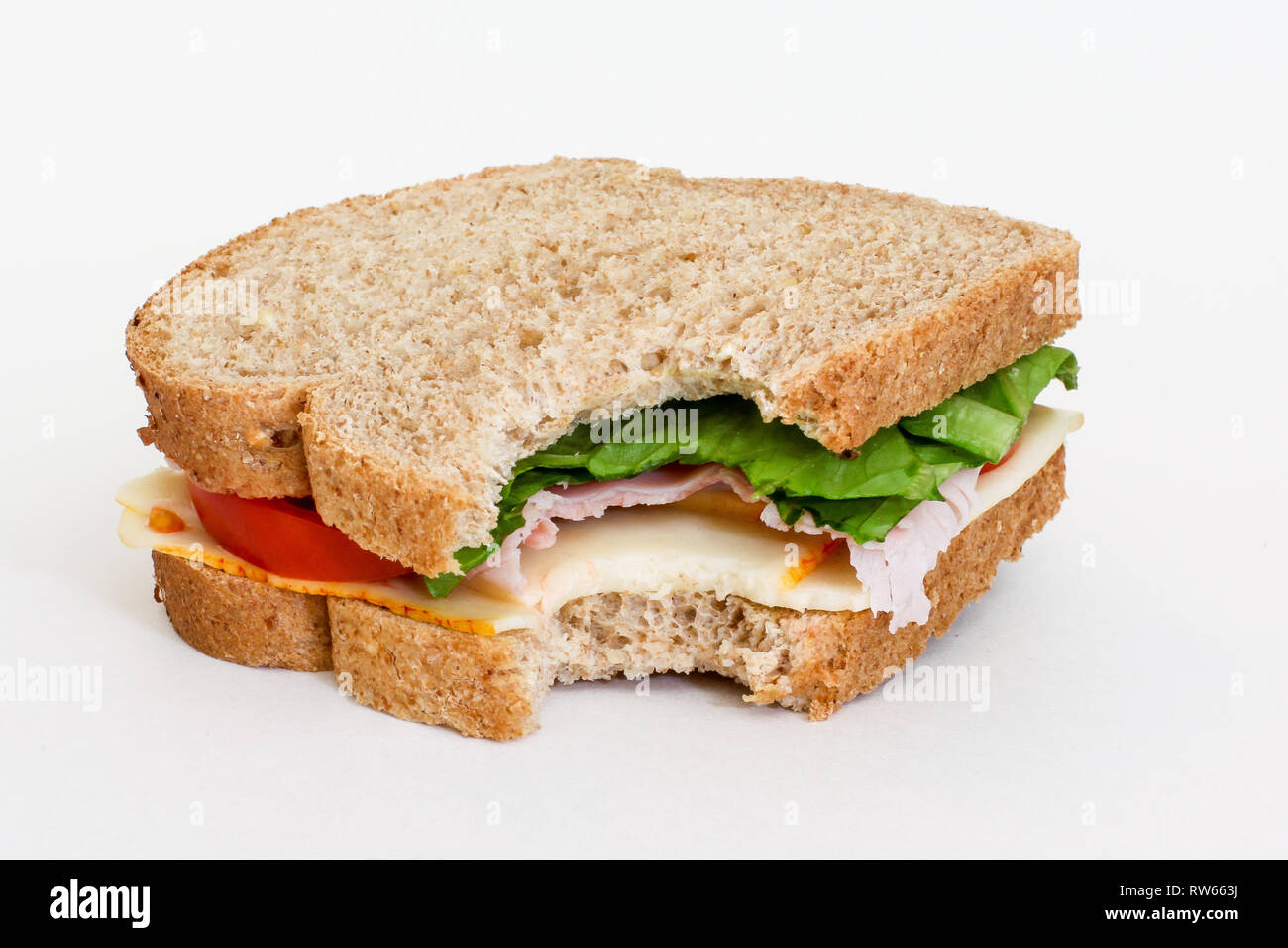 Sandwich on white background with one bite Stock Photo - Alamy