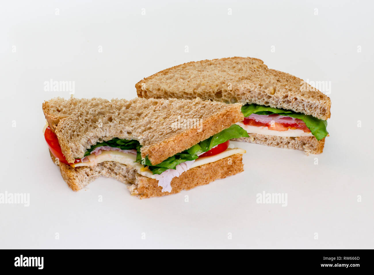 Two half from tasty sandwich on white background Stock Photo - Alamy