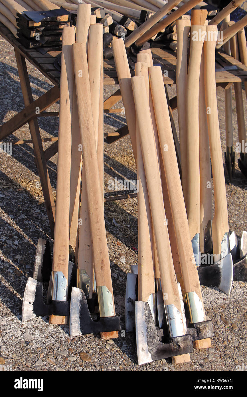 Pile of retro style axes with wooden handle on rural background Stock ...