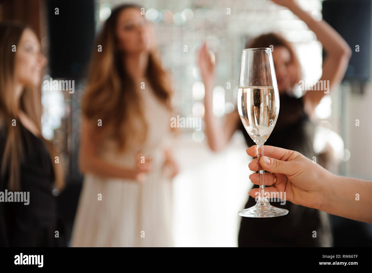 Group people with champagne dancing at the party Stock Photo - Alamy