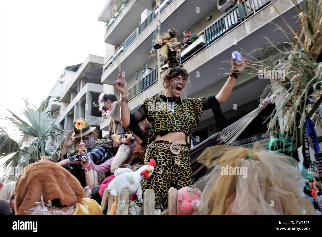 A woman dressed in animal outfit seen celebrating on top of a chariot ...