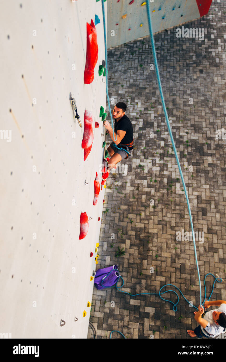 Active lifestyle and bouldering climbing, reaching the top concept ...