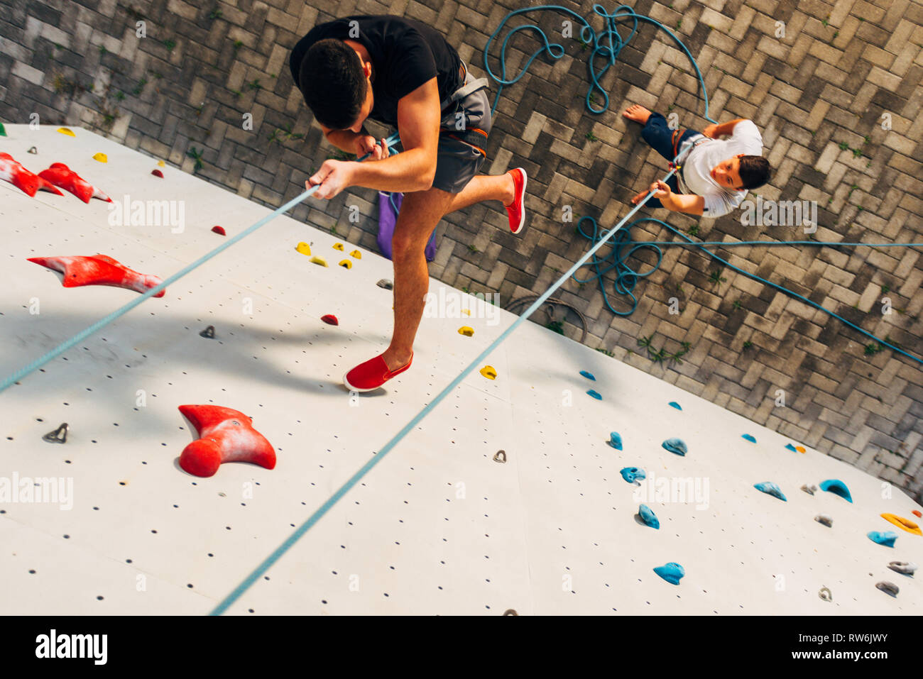 Two climbers bouldering hi-res stock photography and images - Alamy
