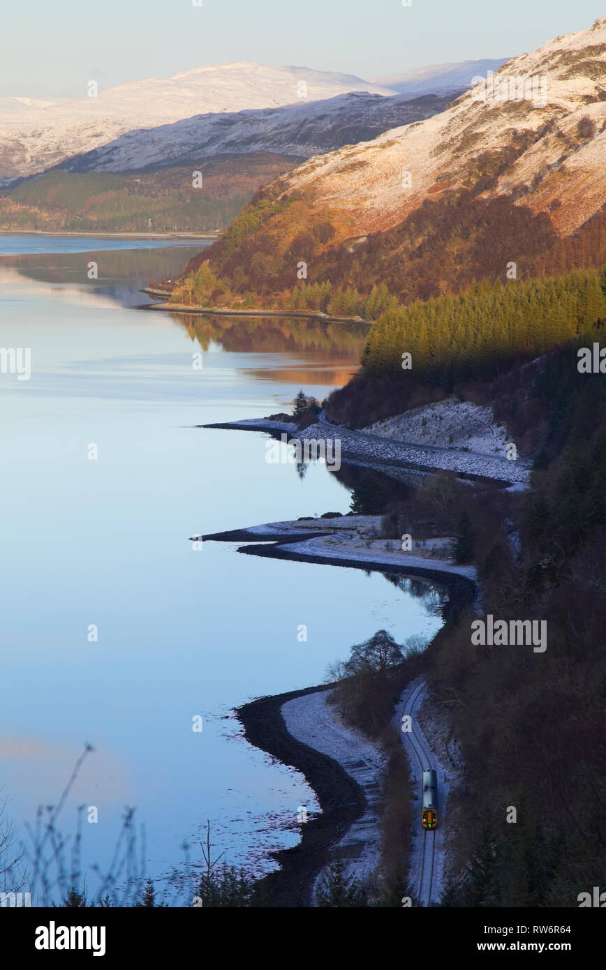 Scotrail train on Kyle of Lochalsh line next to Loch Carron Stock Photo ...