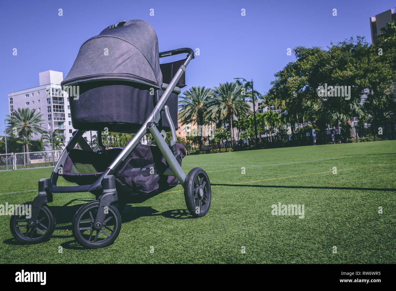 Walking with a baby in the stroller Stock Photo - Alamy