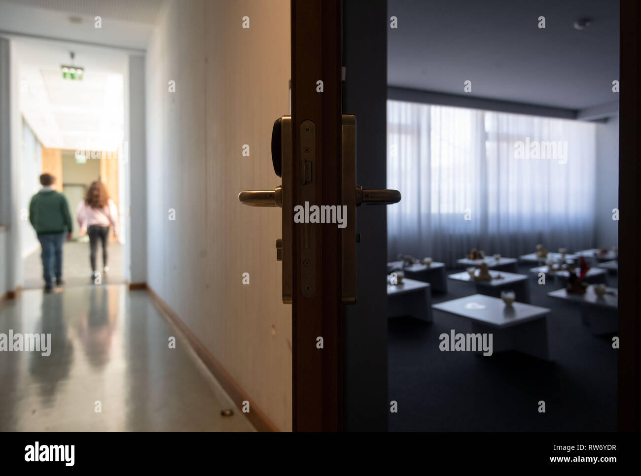 Winnenden, Germany. 27th Feb, 2019. Students walk through a corridor of ...