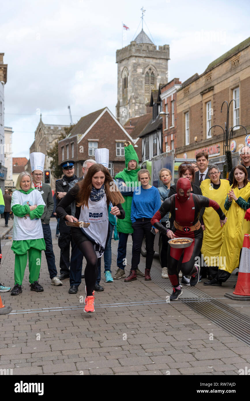 Woman running in a pancake race hi-res stock photography and images - Alamy