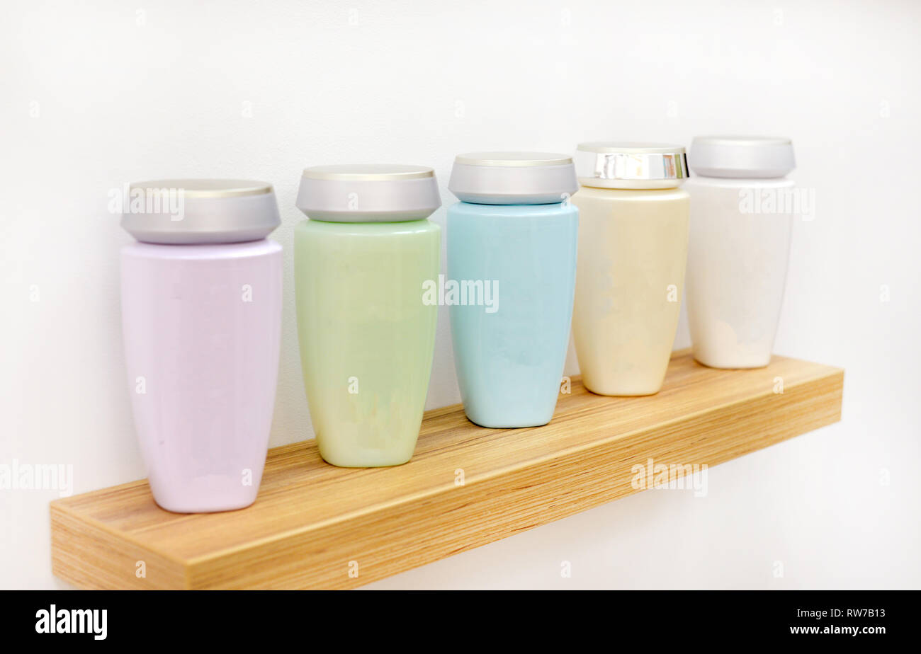 delicate body and face cosmetics. bottles with cosmetics on the shelf ...