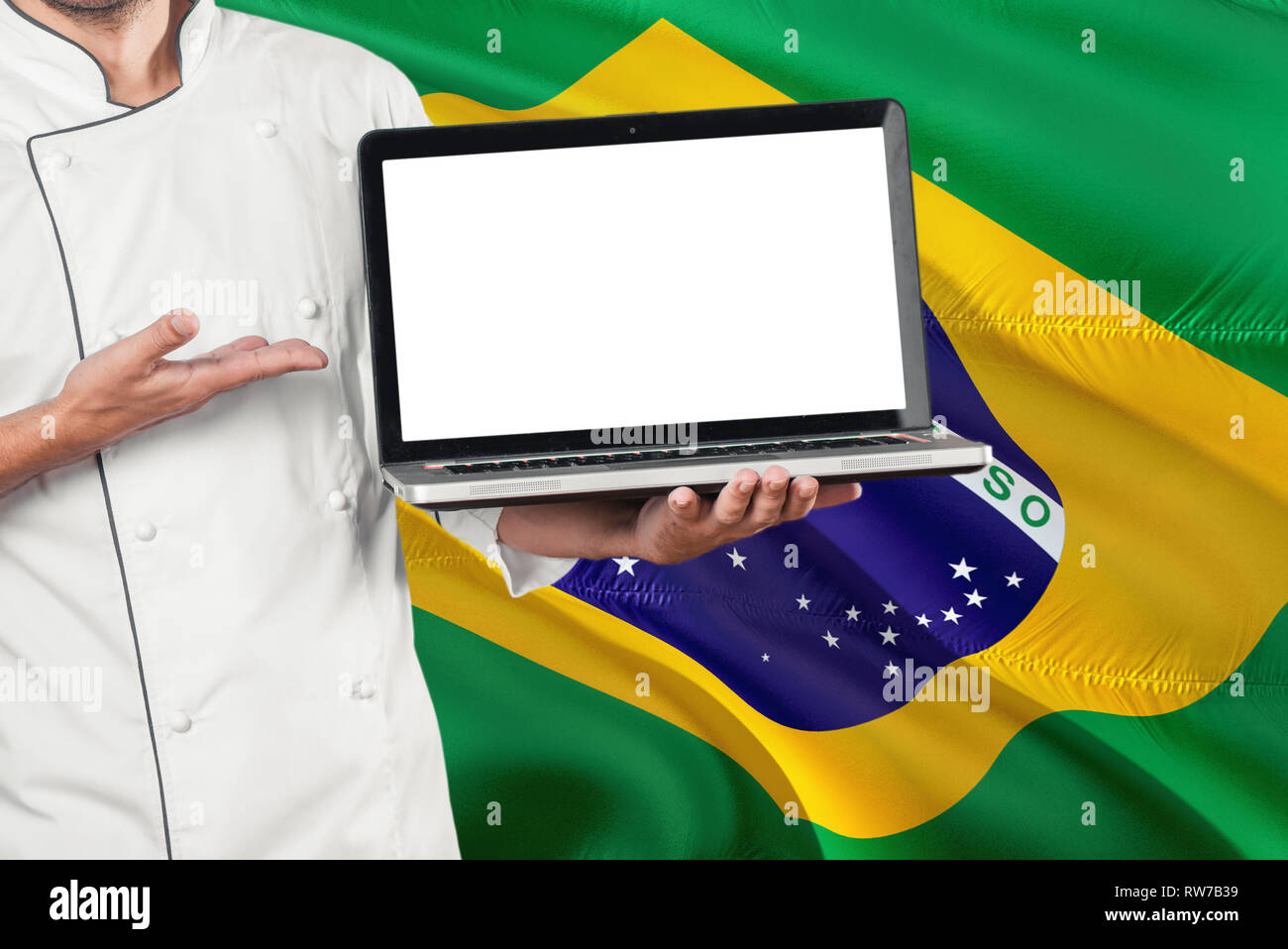 Brazilian Chef holding laptop with blank screen on Brazil flag ...