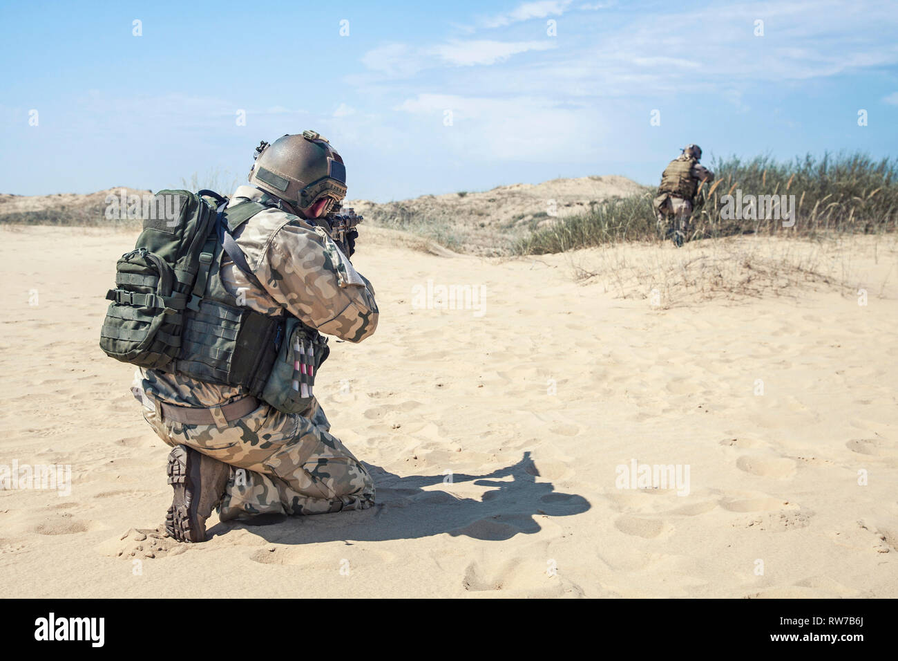 Two soldiers in the desert during the military operation Stock Photo ...