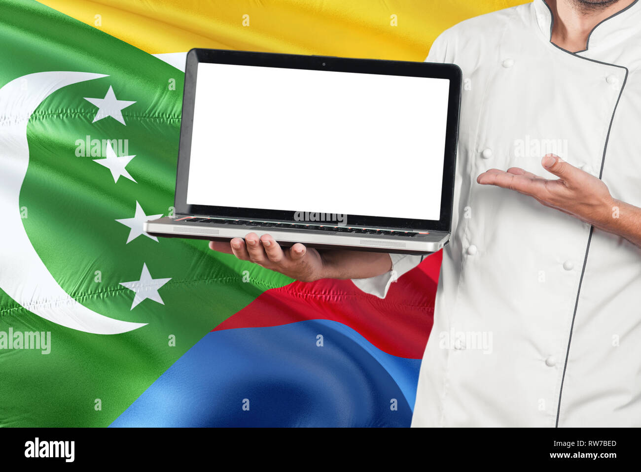 Comoran Chef holding laptop with blank screen on Comoros flag ...