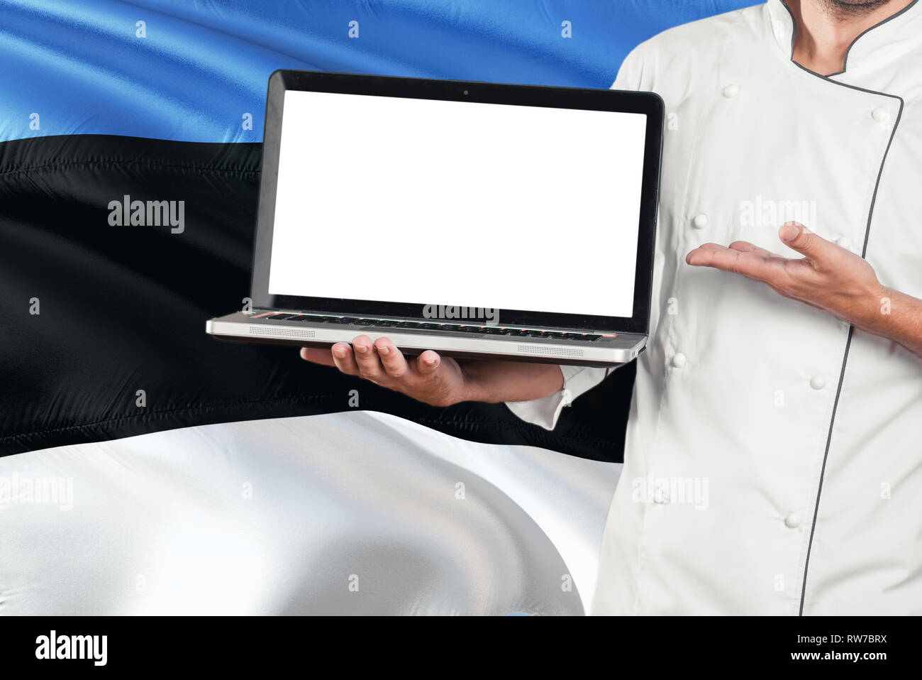 Estonian Chef holding laptop with blank screen on Estonia flag ...