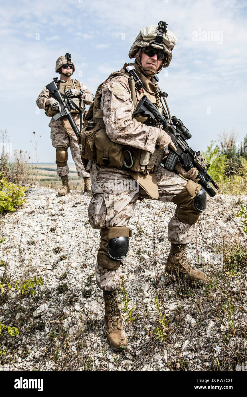 Two soldiers in the mountains during a military operation Stock Photo ...