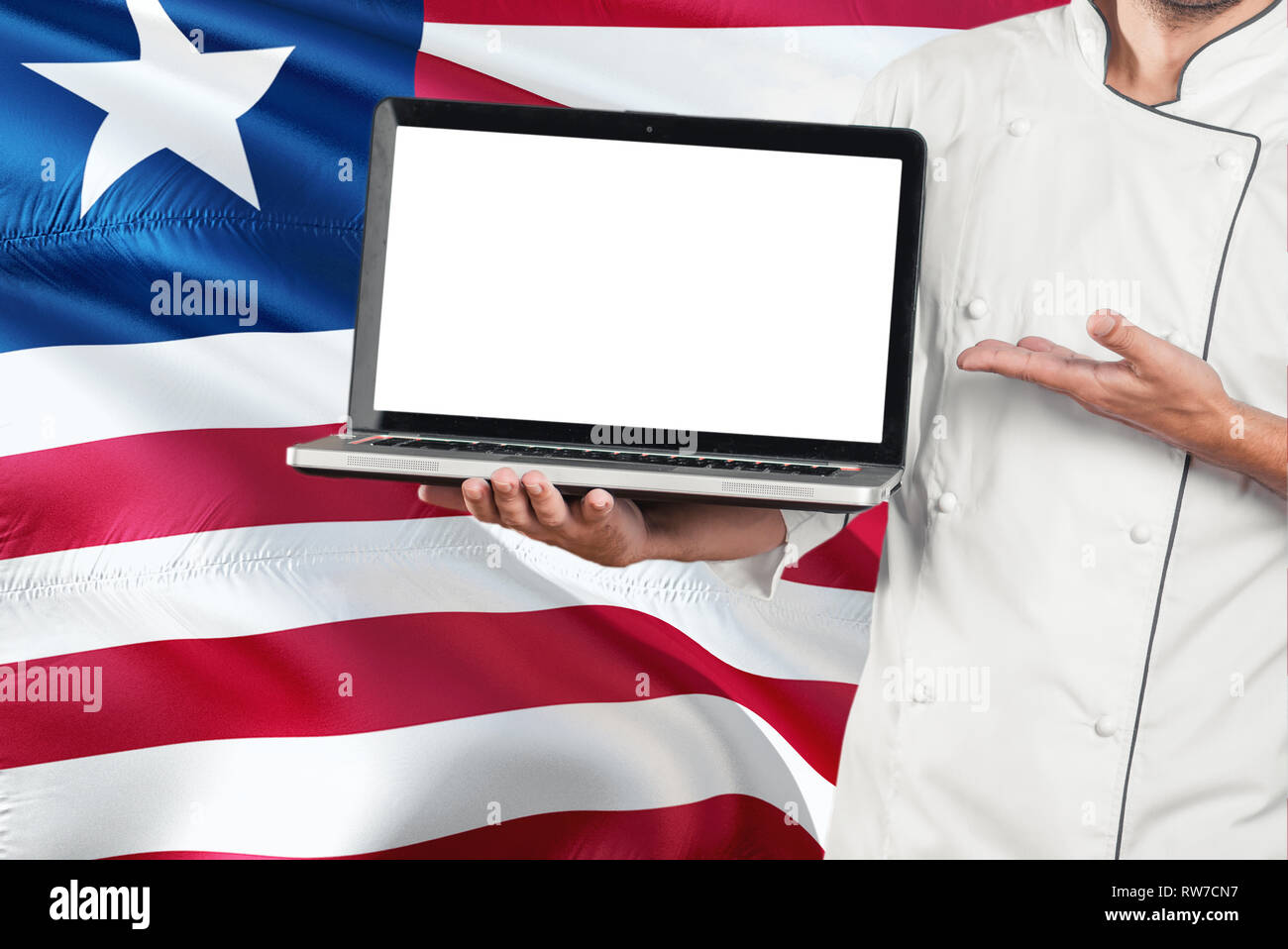 Liberian Chef holding laptop with blank screen on Liberia flag ...