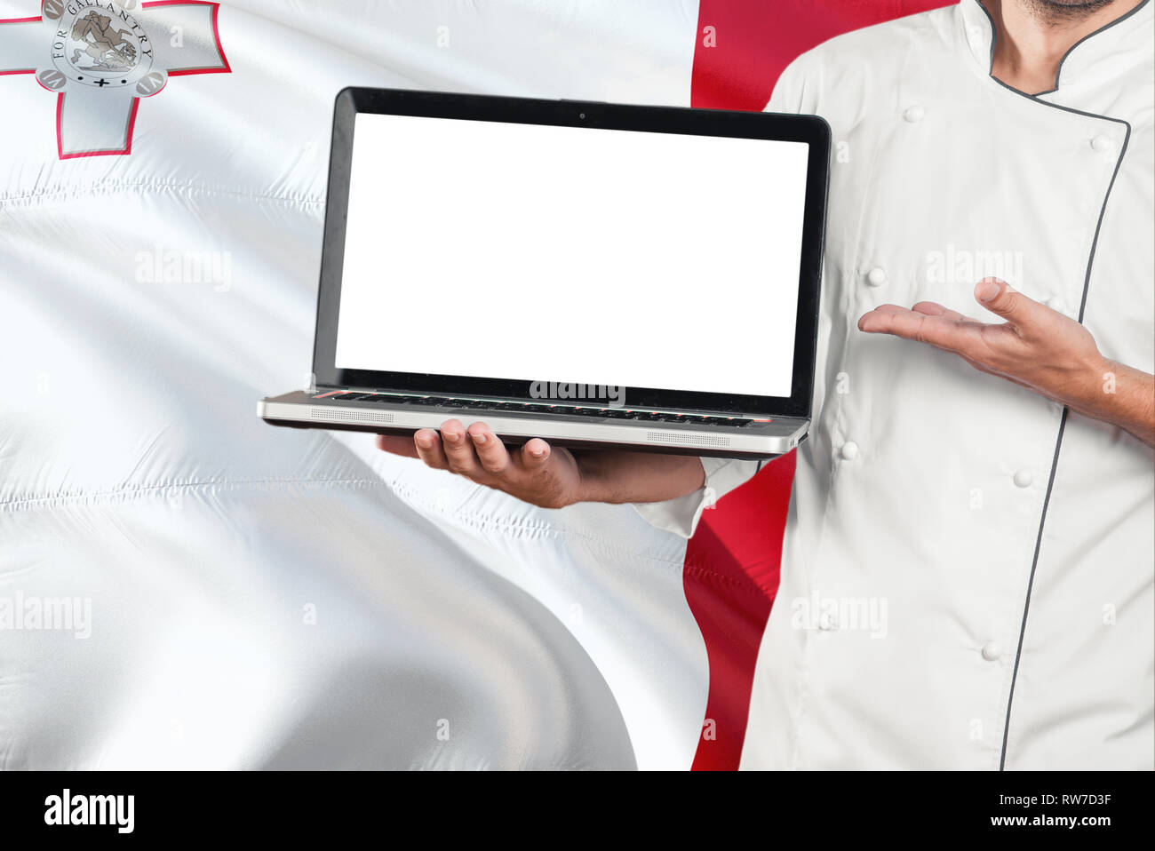 Maltese Chef holding laptop with blank screen on Malta flag background ...