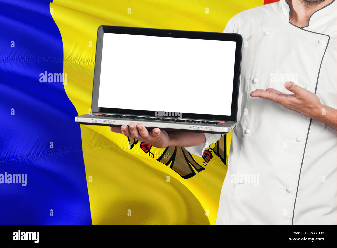 Moldovan Chef holding laptop with blank screen on Moldova flag ...