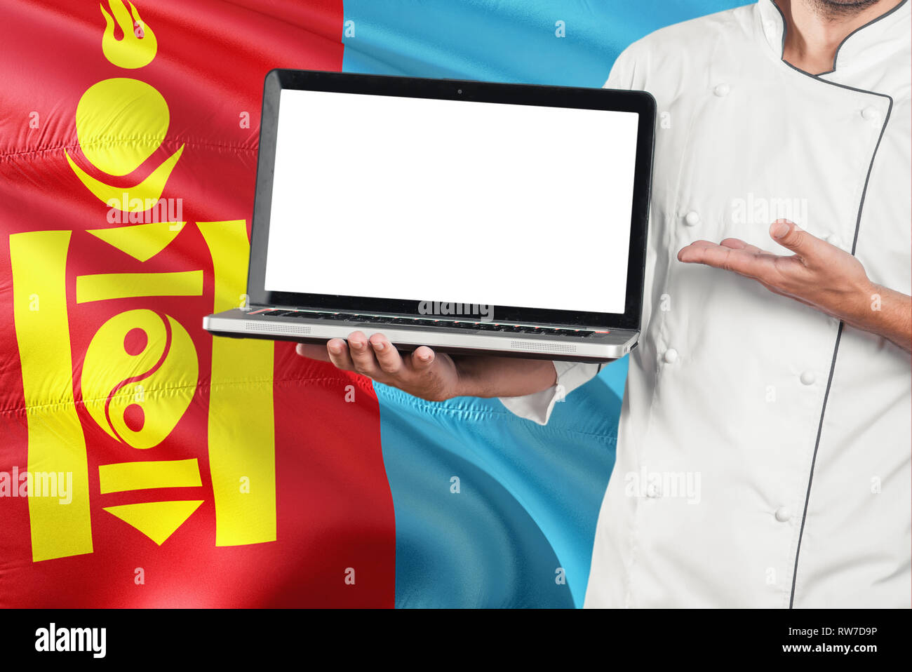 Mongolian Chef holding laptop with blank screen on Mongolia flag ...