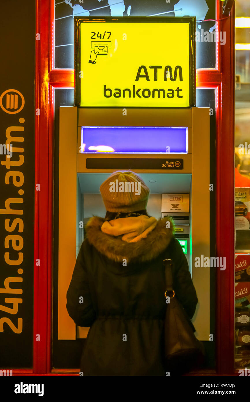 Zagreb, Croatia - 29th, December 2018 : People picking up money on the ...
