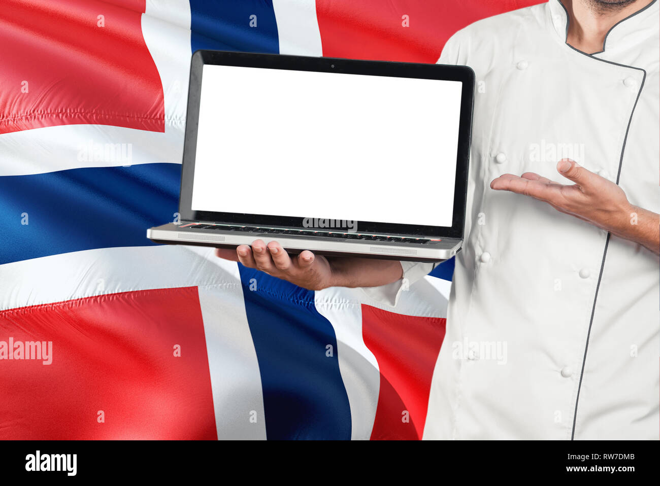 Norwegian Chef holding laptop with blank screen on Norway flag ...