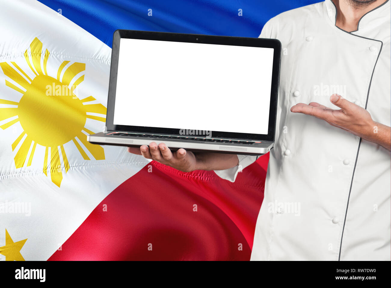 Filipino Chef holding laptop with blank screen on Philippines flag ...