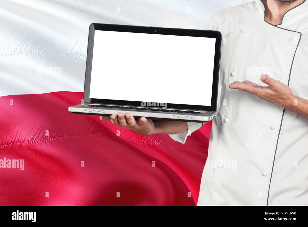 Polish Chef holding laptop with blank screen on Poland flag background ...