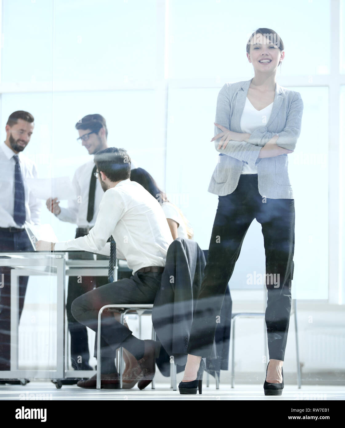 modern business woman standing in office Stock Photo - Alamy