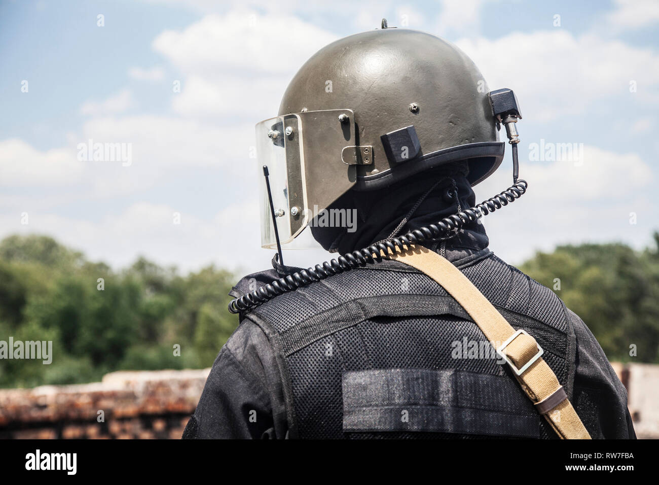 Spec ops soldier in black uniform and face mask with his rifle Stock ...