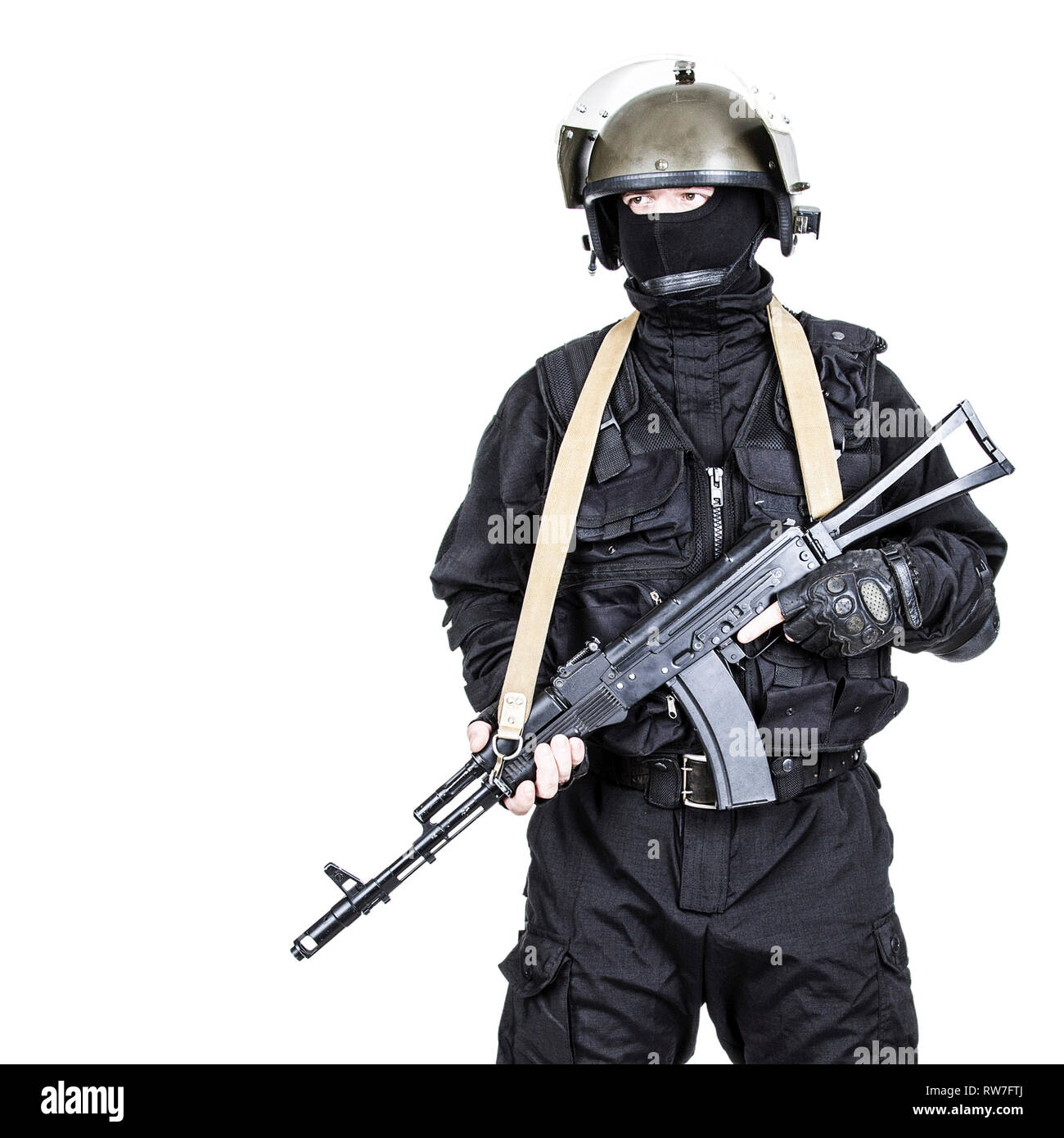 Spec ops soldier in black uniform and face mask with his rifle Stock ...
