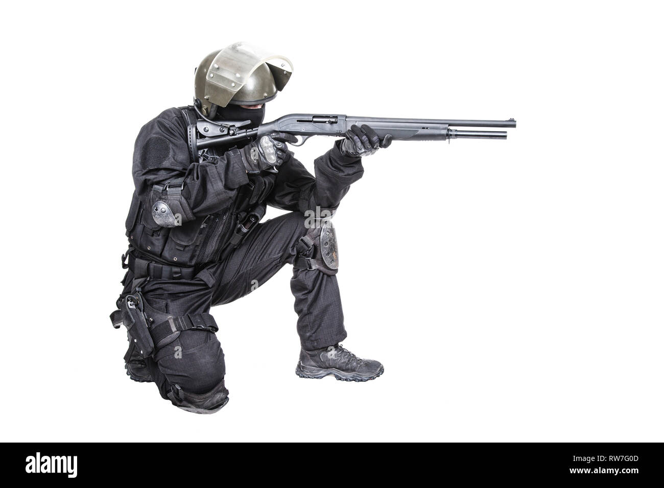 Spec ops soldier in black uniform and face mask with shotgun Stock ...