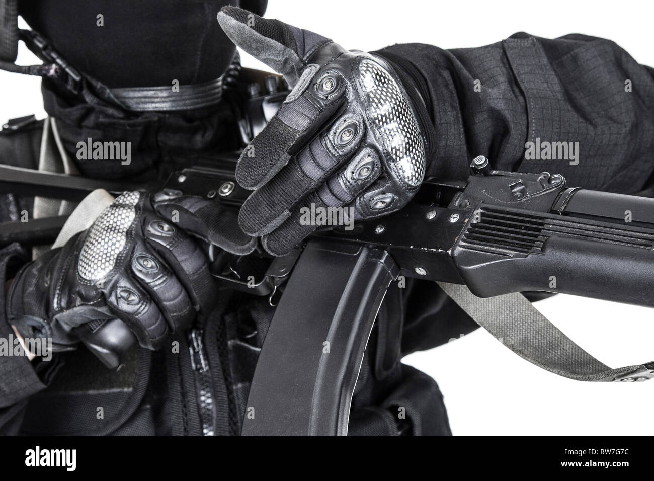 Spec ops soldier in black uniform and face mask with his rifle Stock ...