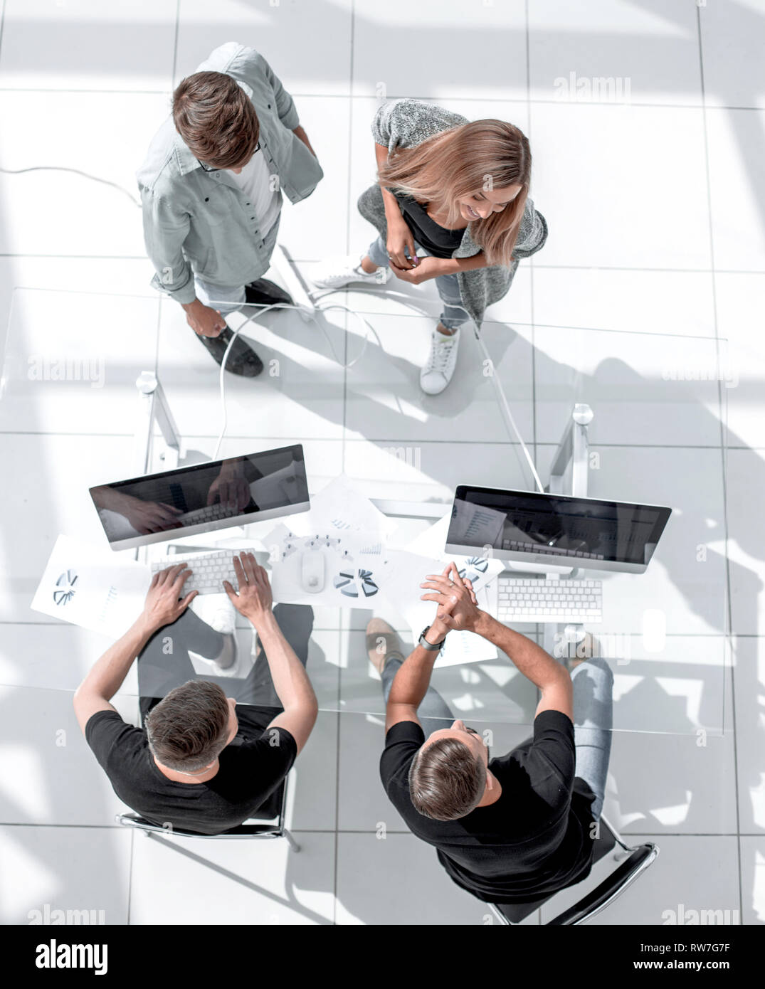 managers ask questions to employees Stock Photo - Alamy