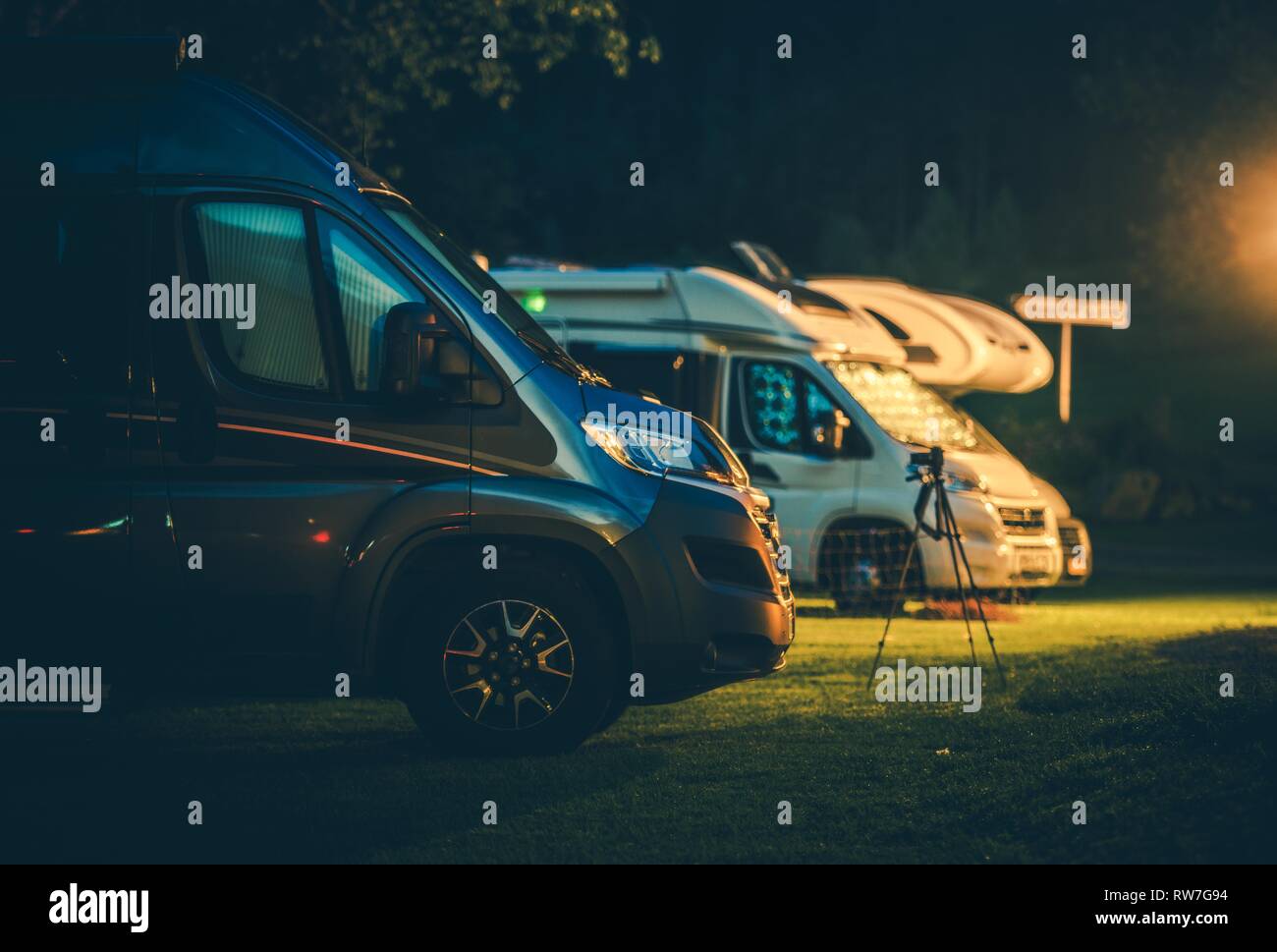Travel Industry. Modern Camper Vans in the RV Park During Night Hours ...