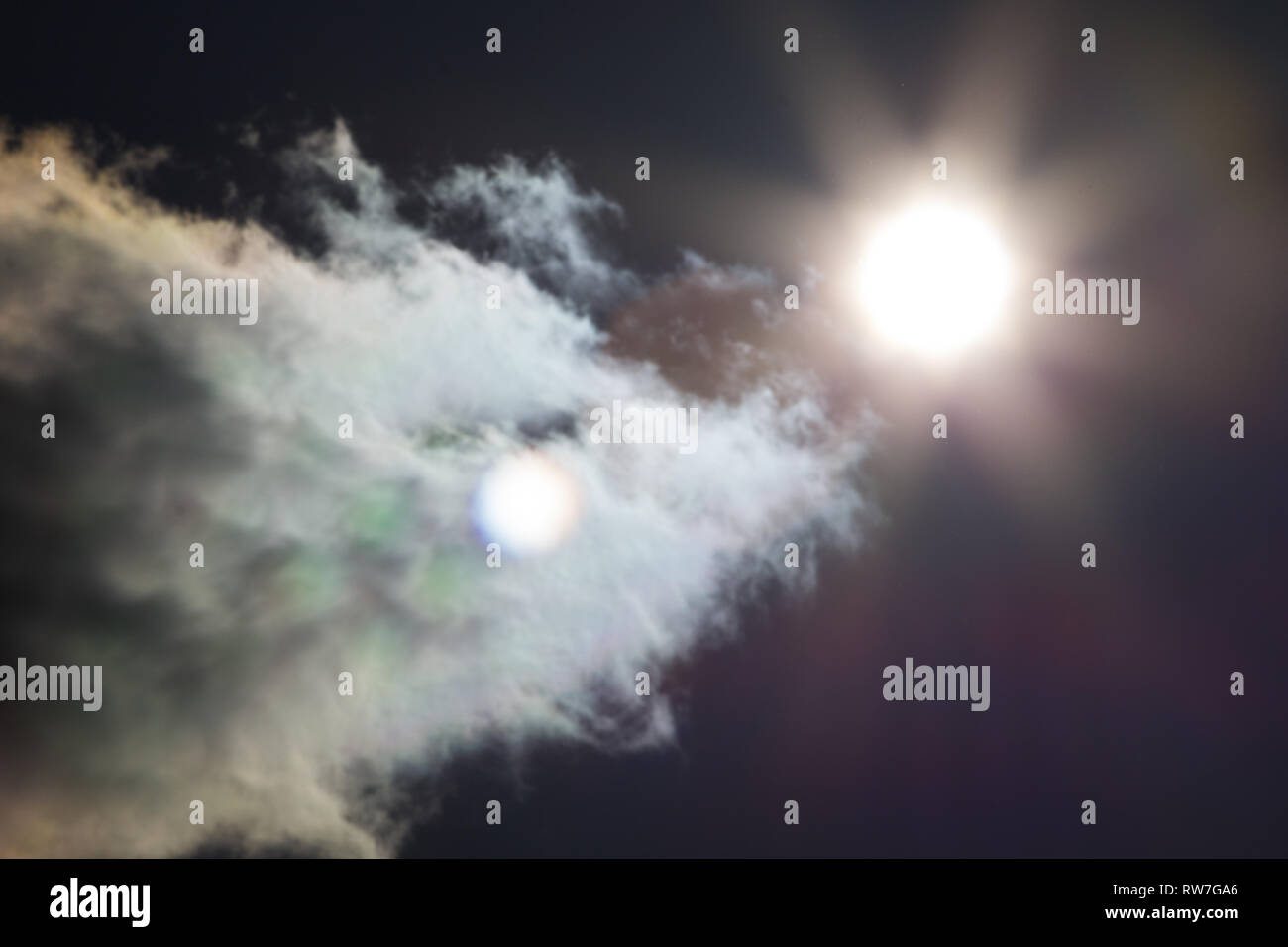 Starburst Sun and Clouds Stock Photo - Alamy