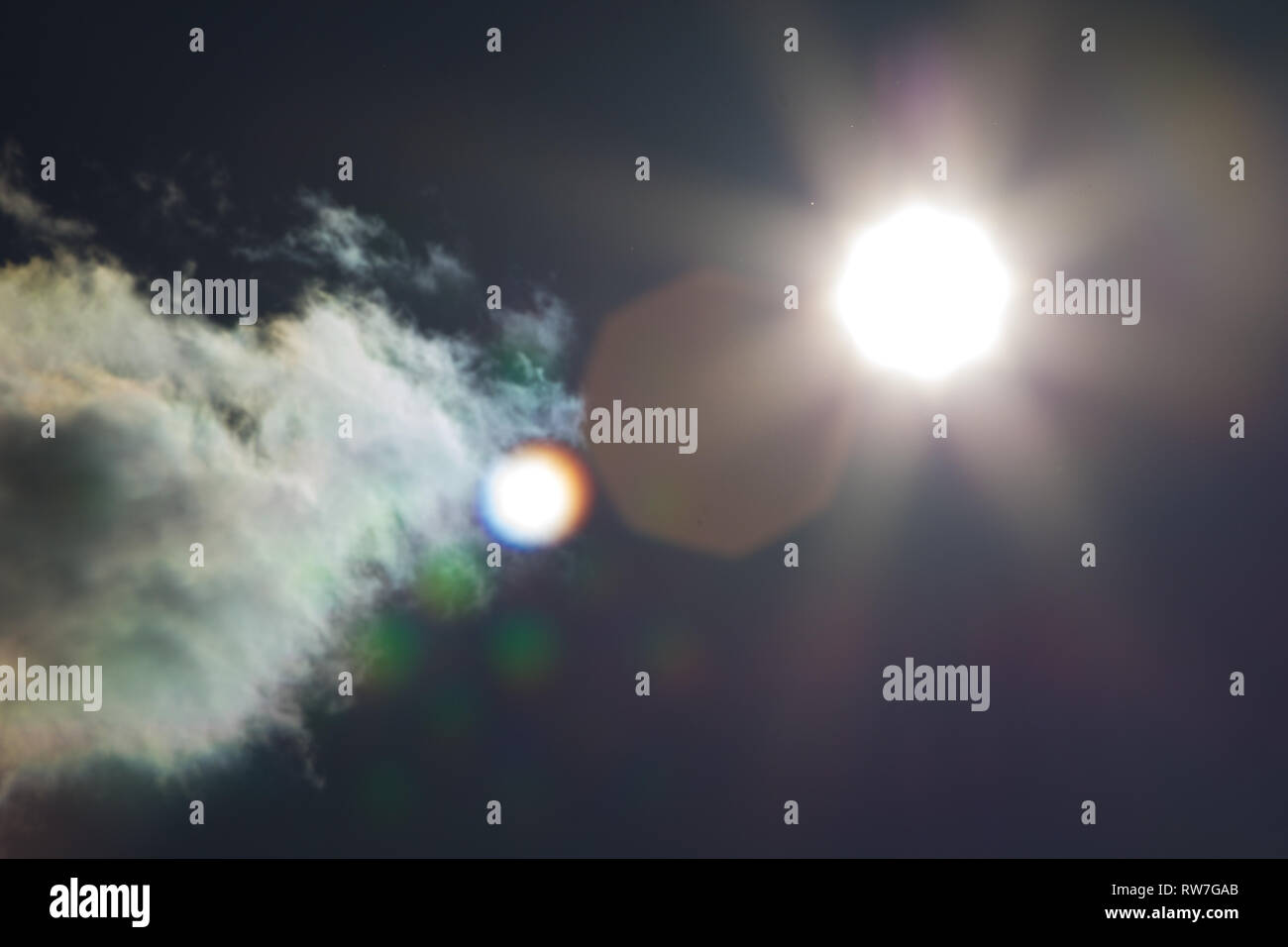 Starburst Sun and Clouds Stock Photo - Alamy