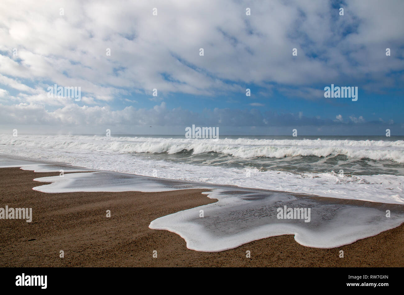 Pacific ocean wave tidal overflowing into Santa Clara river estuary at ...