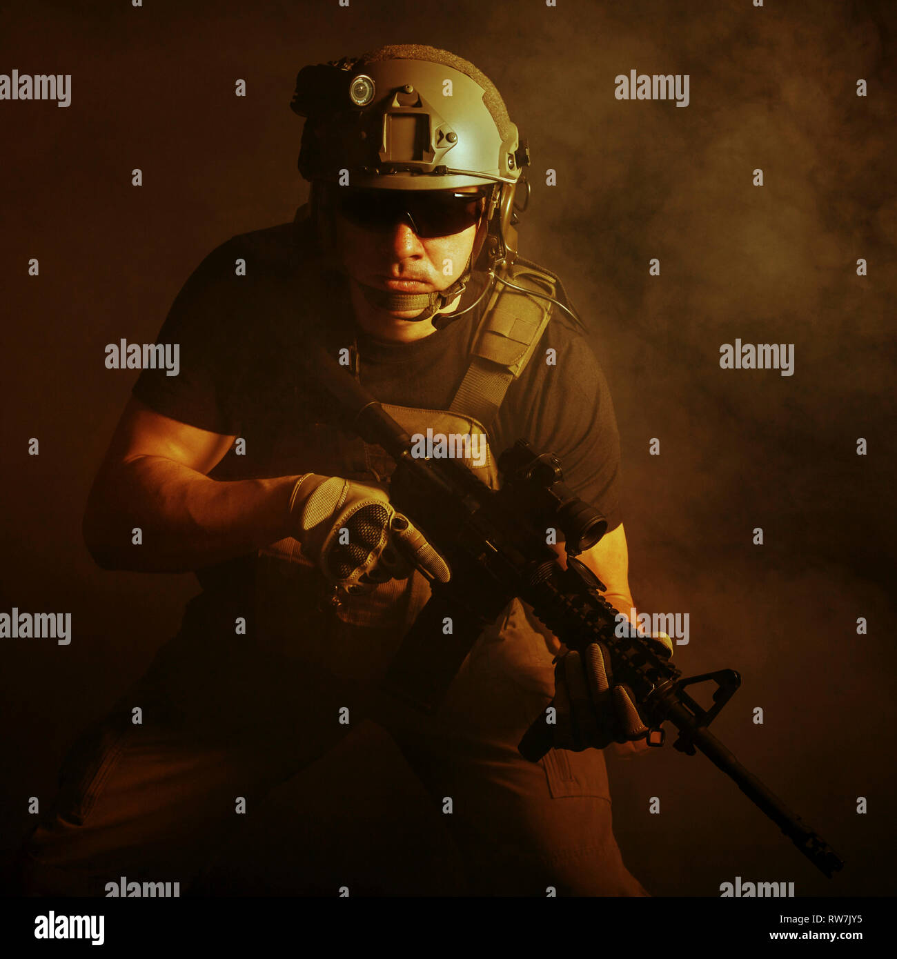 Private military contractor PMC with assault rifle on dark background ...