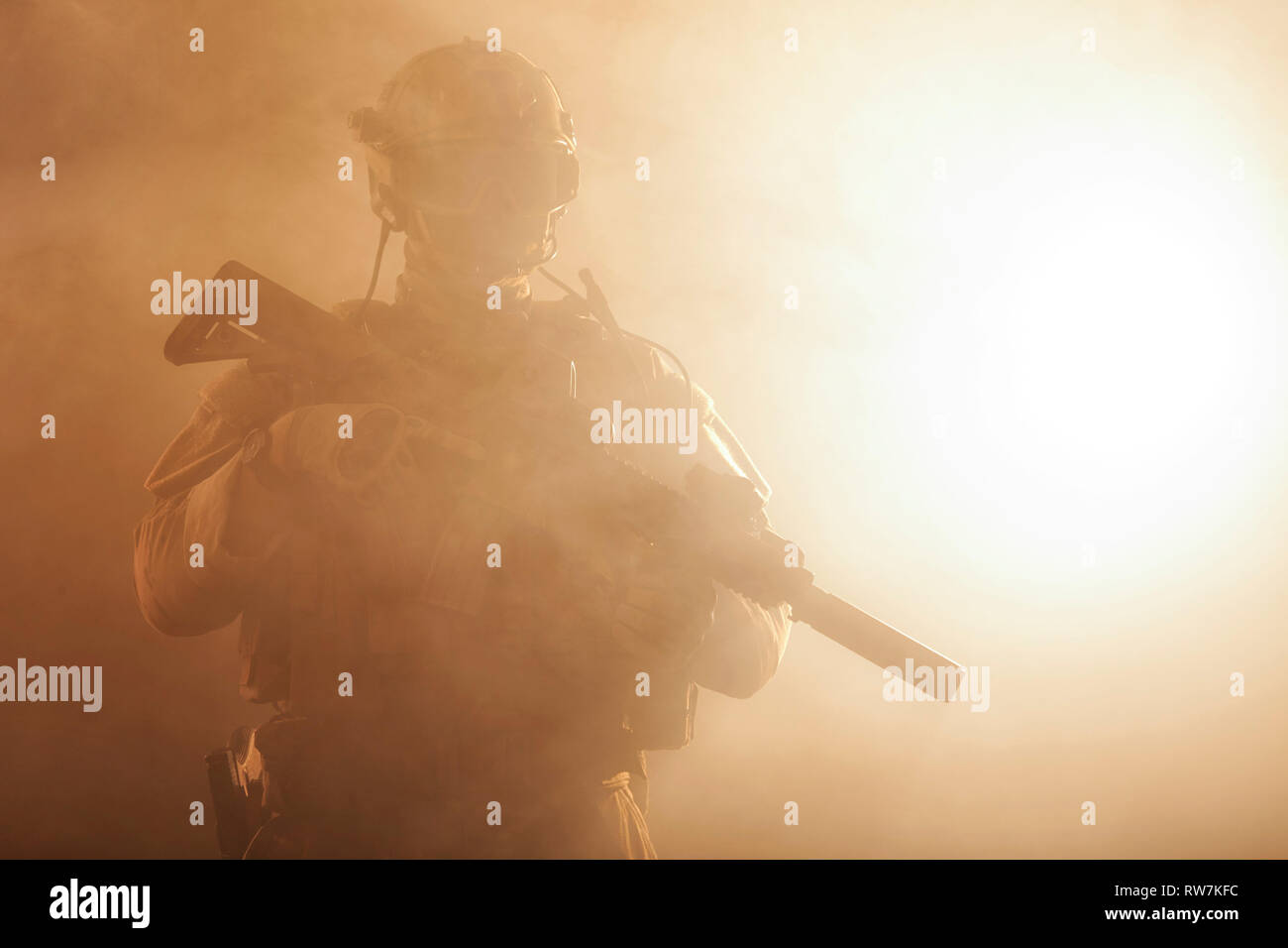 Special forces soldier with rifle in the smoke Stock Photo - Alamy