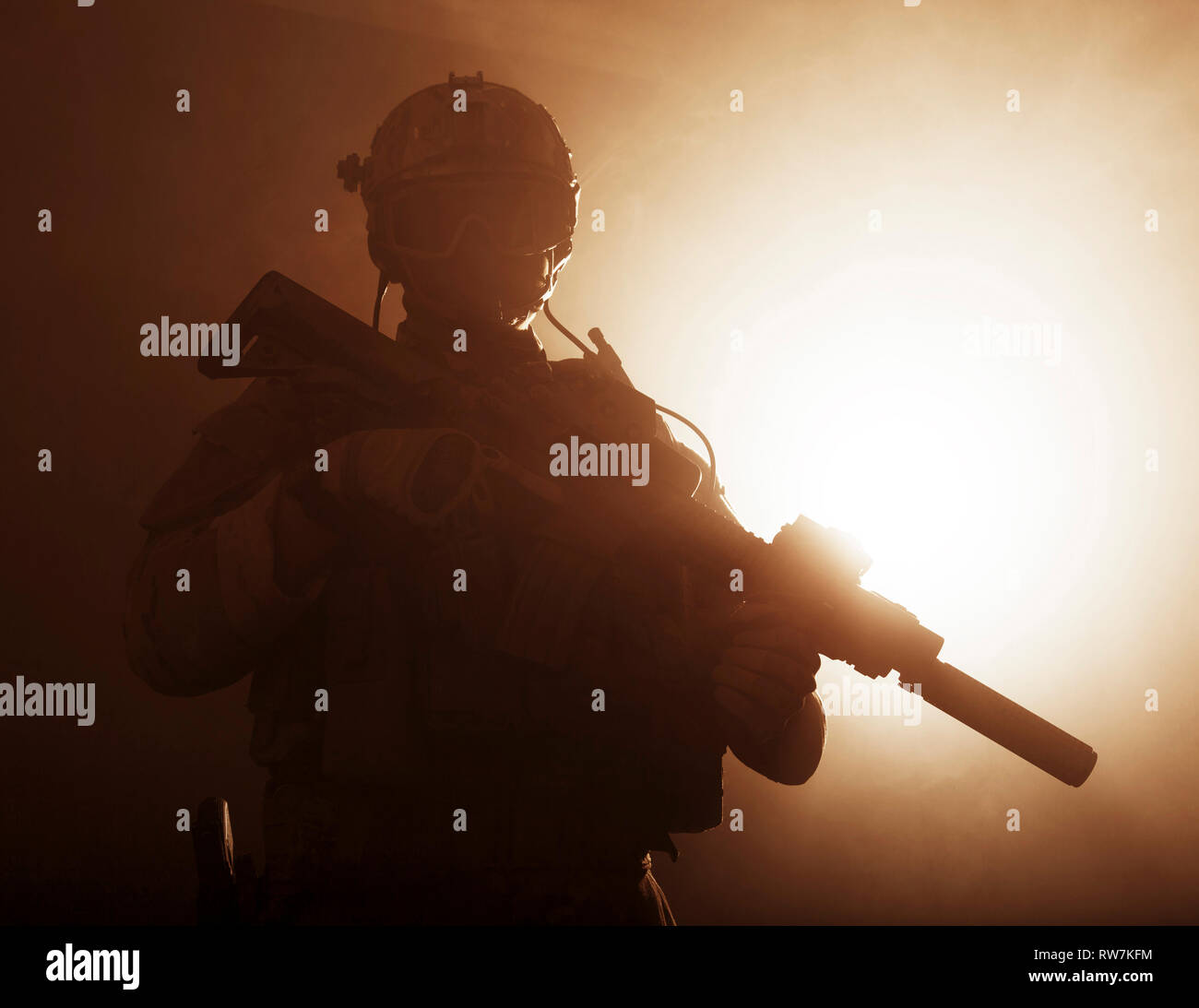Special forces soldier with rifle in the smoke Stock Photo - Alamy