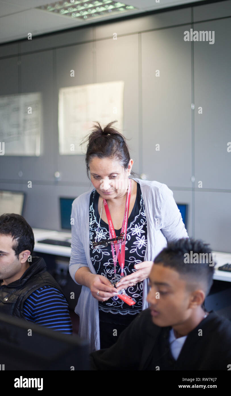 teacher at a further education college teaching in a classroom Stock ...