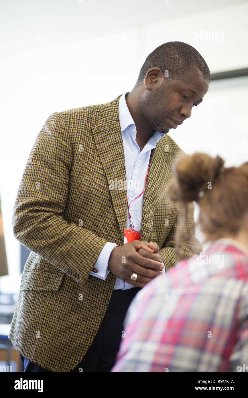 teacher at a further education college teaching in a classroom Stock ...
